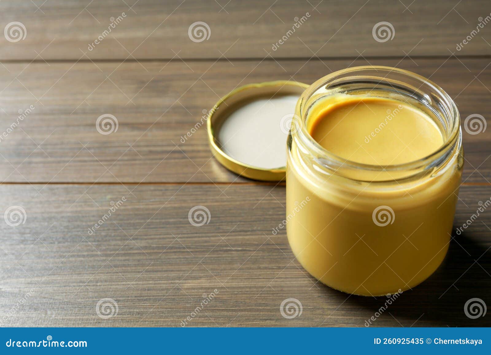 Spicy Mustard in Glass Jar on Wooden Table. Space for Text Stock Image ...