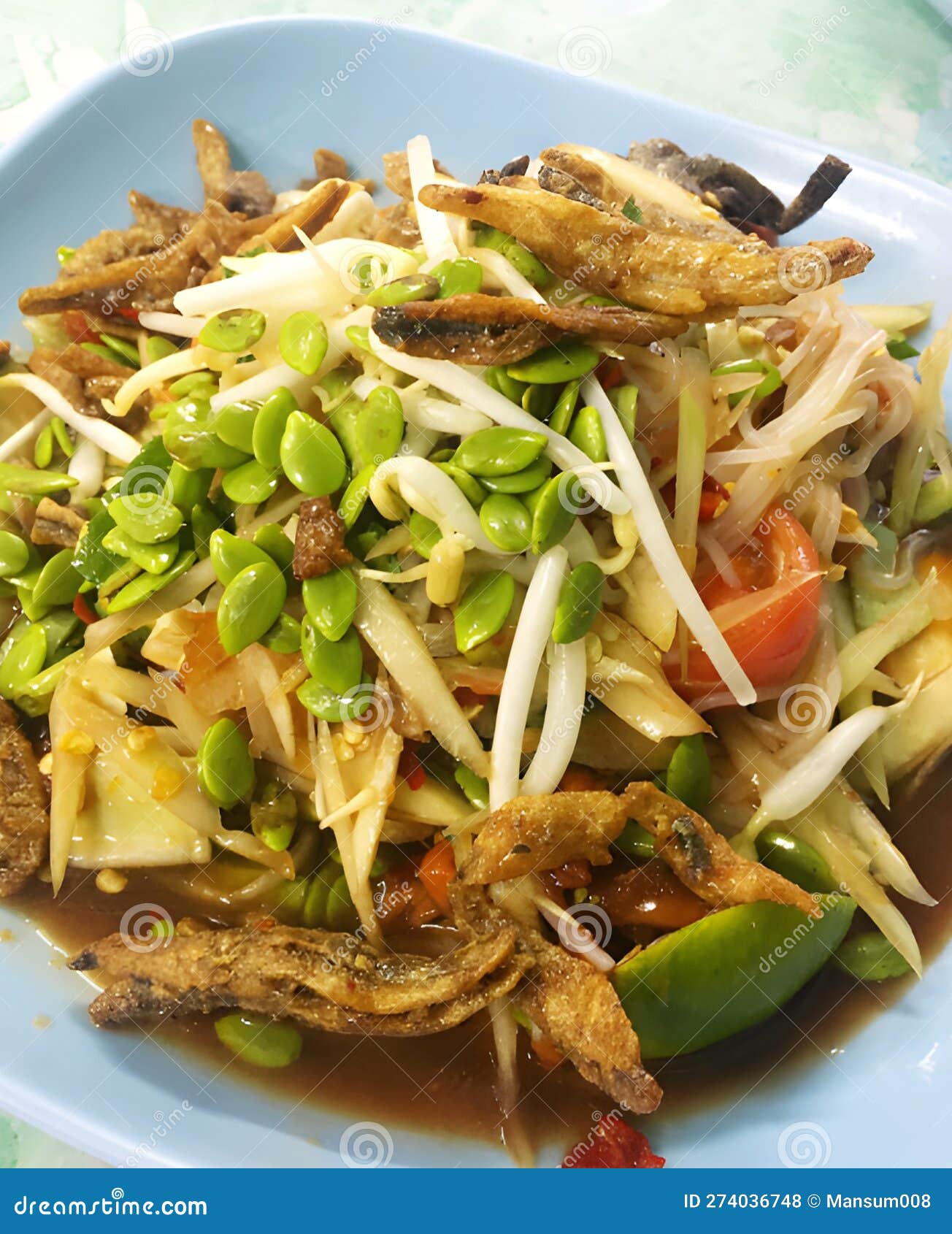 Spicy Papaya Salad with Crispy Fish Stock Photo - Image of papaya ...