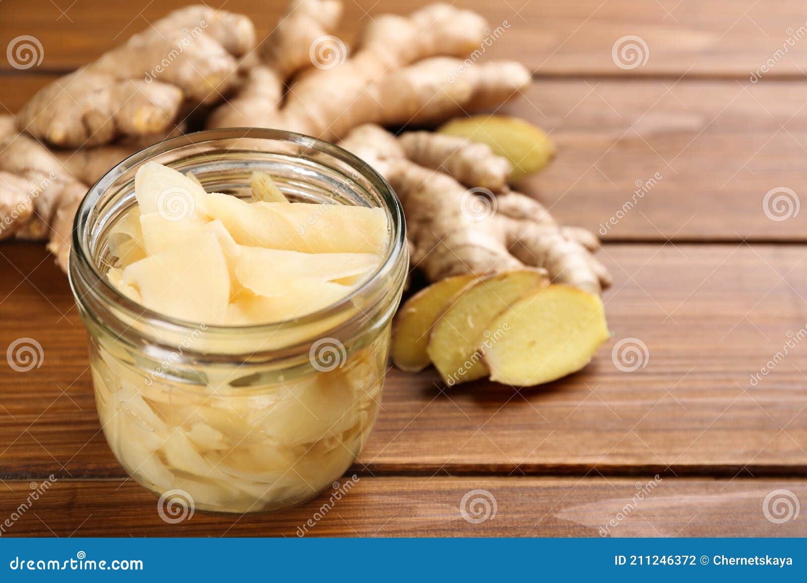 Spicy Pickled Ginger and Root on Wooden Table, Space for Text Stock ...