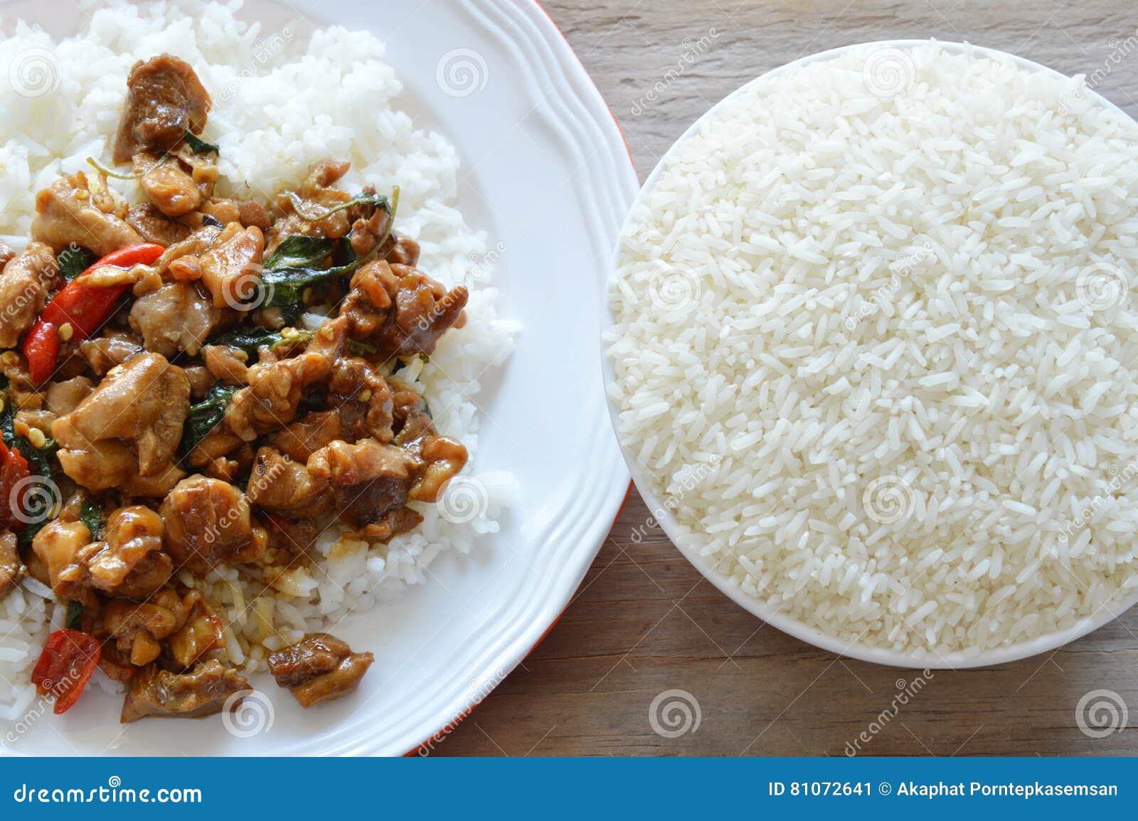 Spicy Stir Fried Chicken with Basil Leaf on Rice and Paddy in Bowl ...