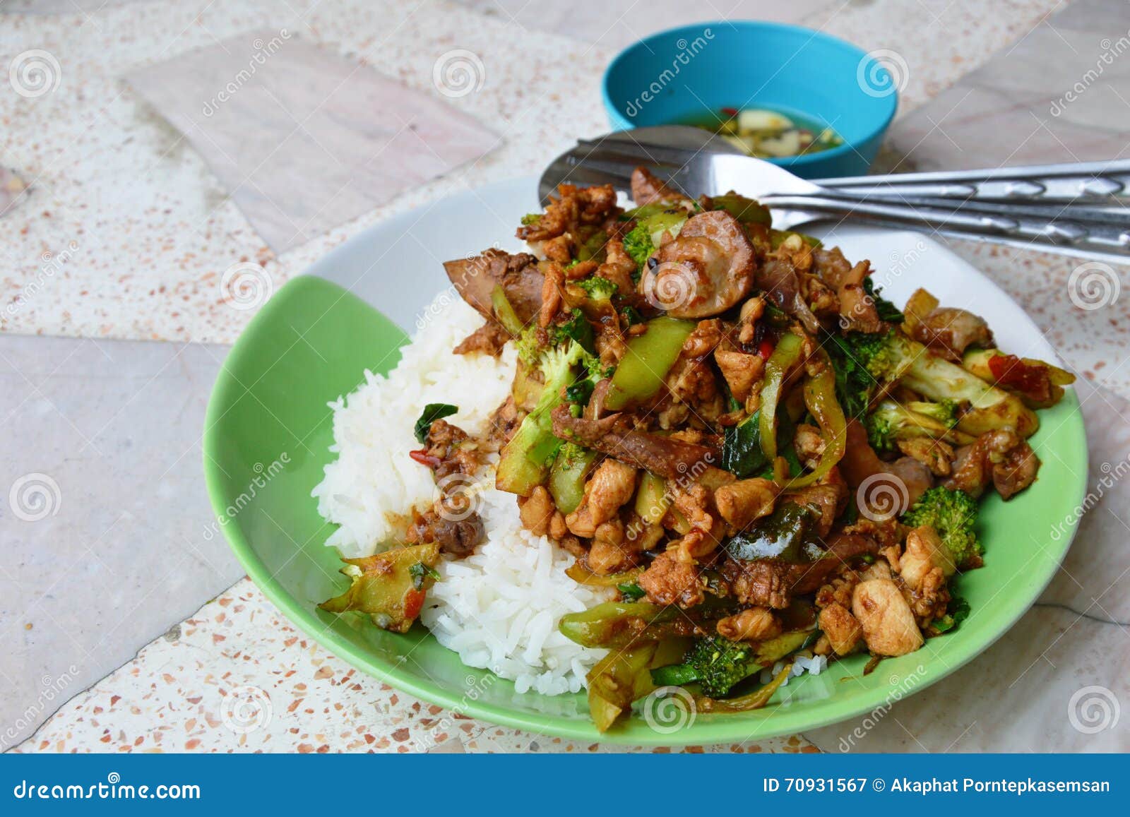 Spicy Stir-fried Chicken Innards with Basil Leaves on Rice Stock Image ...