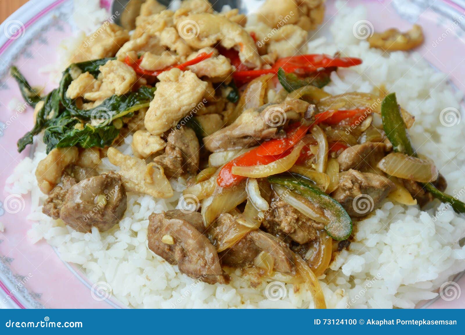 Spicy Stir Fried Chicken Meat and Entrails with Basil Leaf on Rice ...