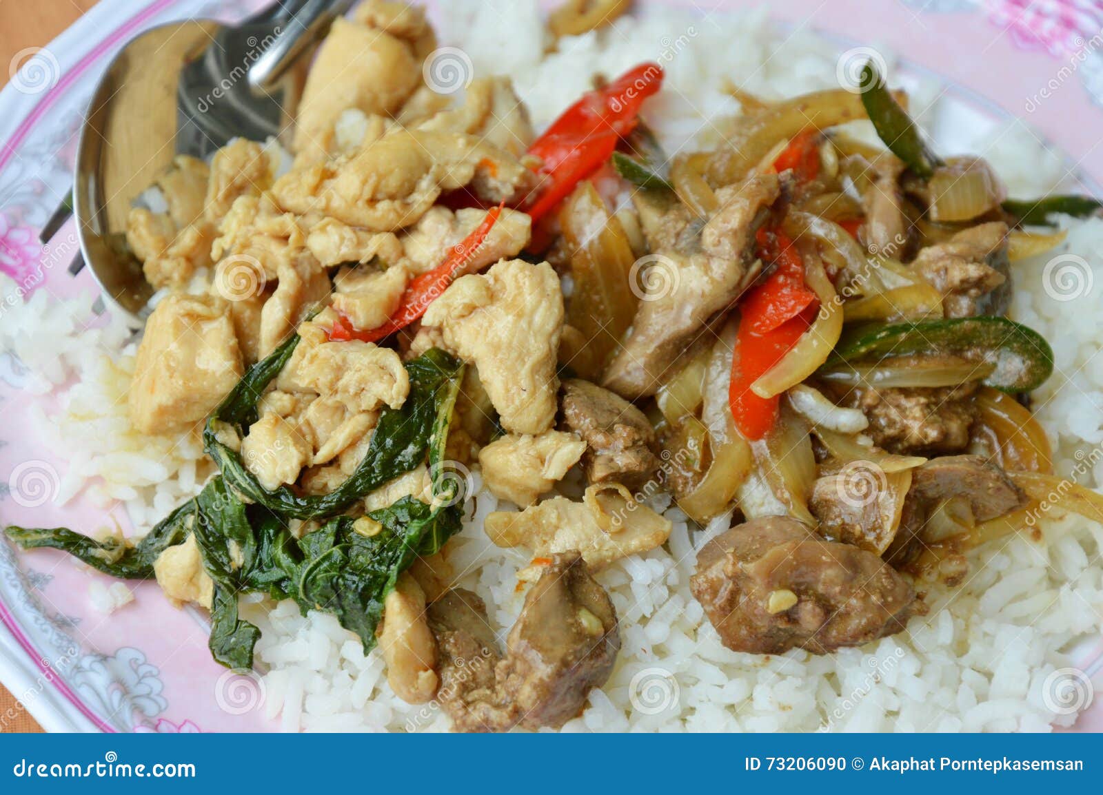 Spicy Stir Fried Chicken Meat and Entrails with Basil Leaf on Rice ...