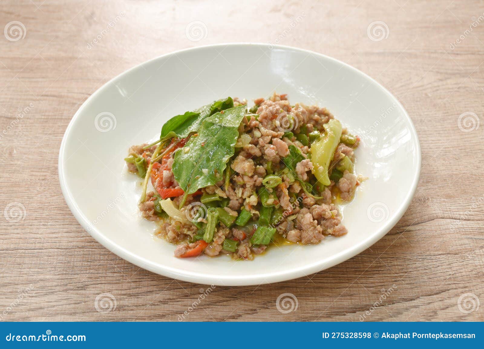 Spicy Stir Fried Chop Pork with Chili and Basil Leaf on Plate Stock ...