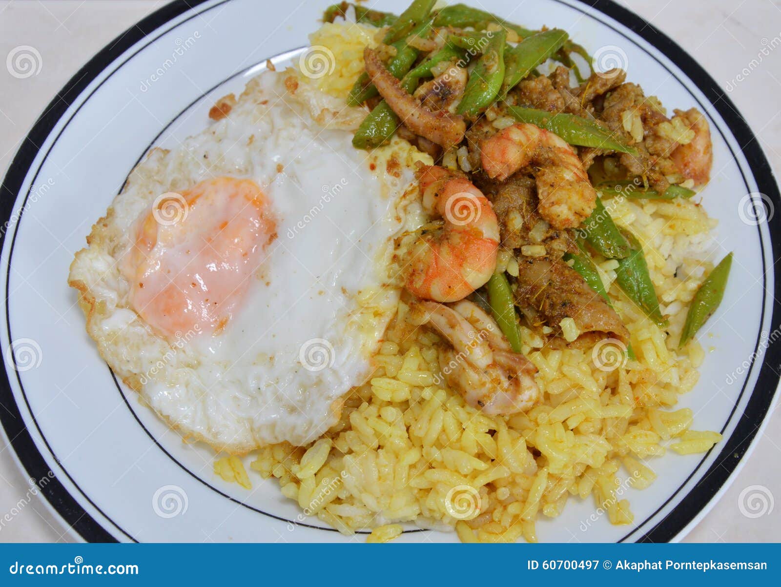 Spicy Stir-fried Seafood with Curry Topping Fried Egg on Rice Stock ...