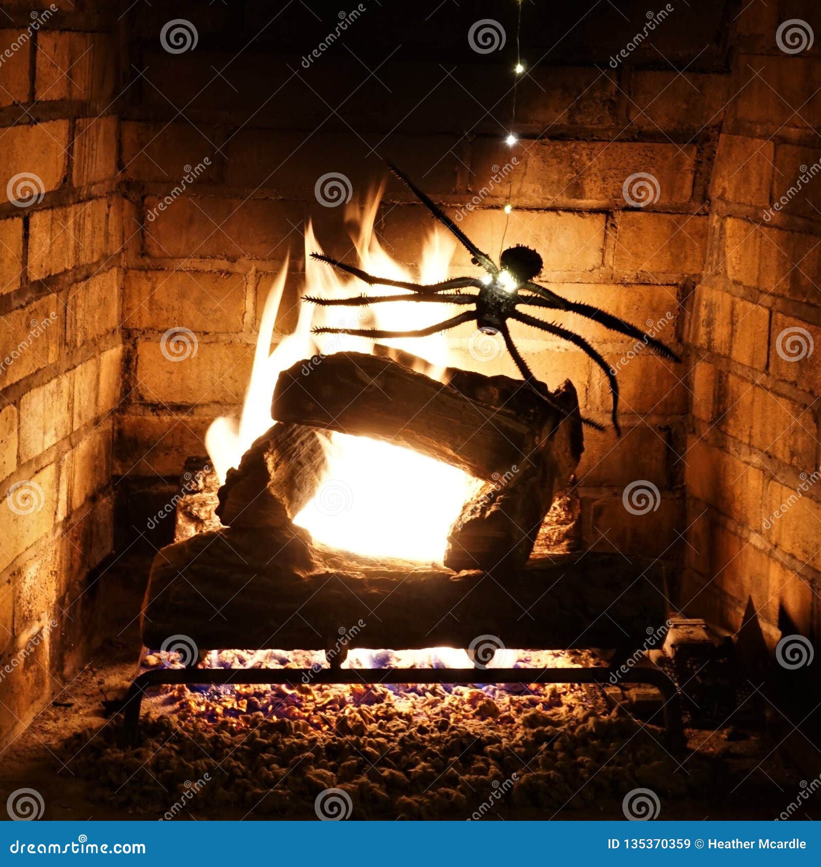 Fake Toy Spider Descends by Tealight Spinnaret Roaring Fire Stock Image ...