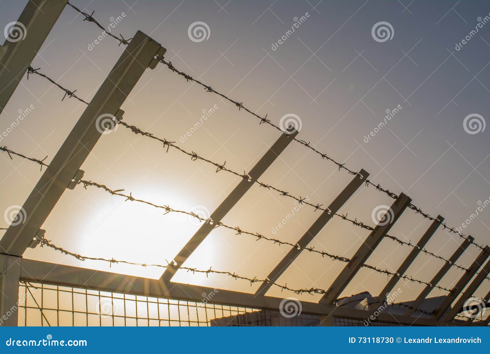 Spiked Wire on the Fence in the Prison during the Sunset Time Stock ...