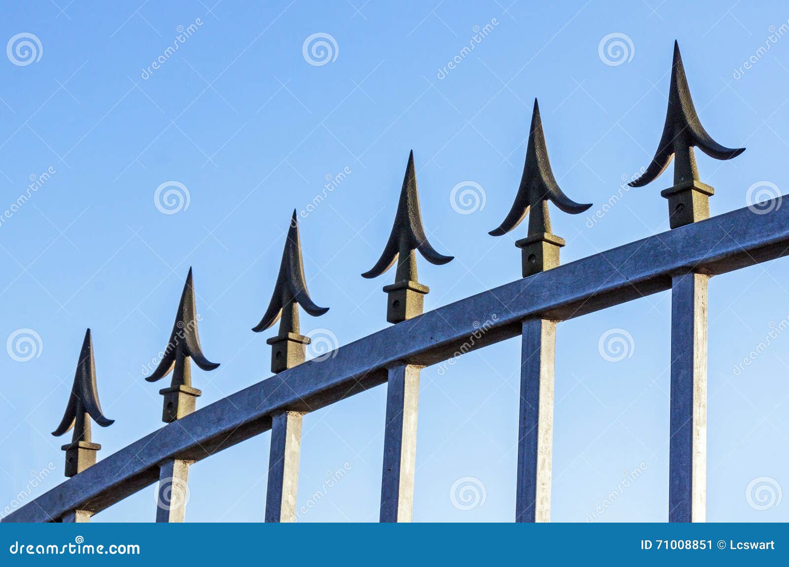 Spikes on Galvanised Gate Against Blue Sky Stock Image - Image of ...