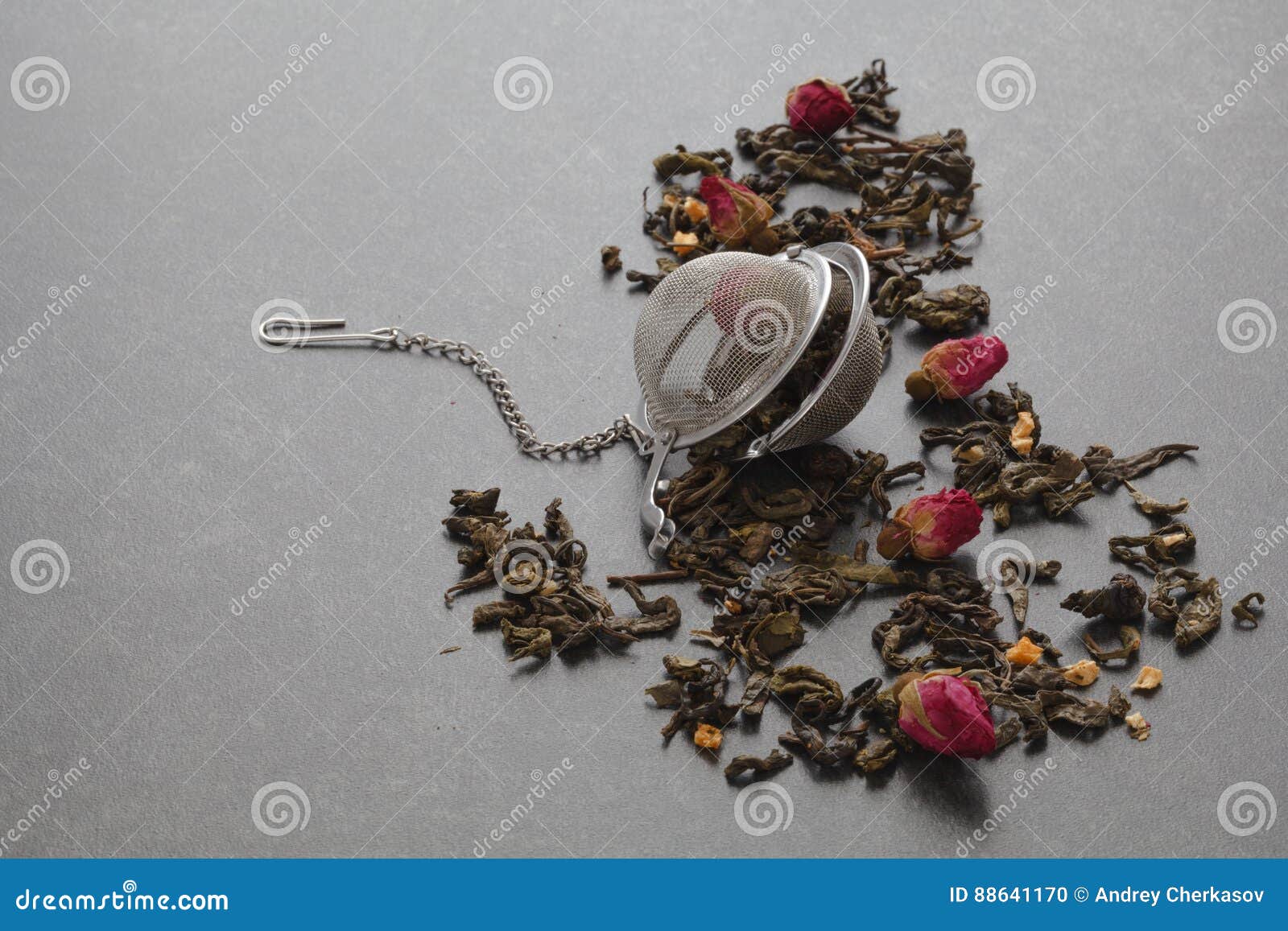 Spilled Green Tea with a Rose and a Strainer Stock Photo - Image of ...