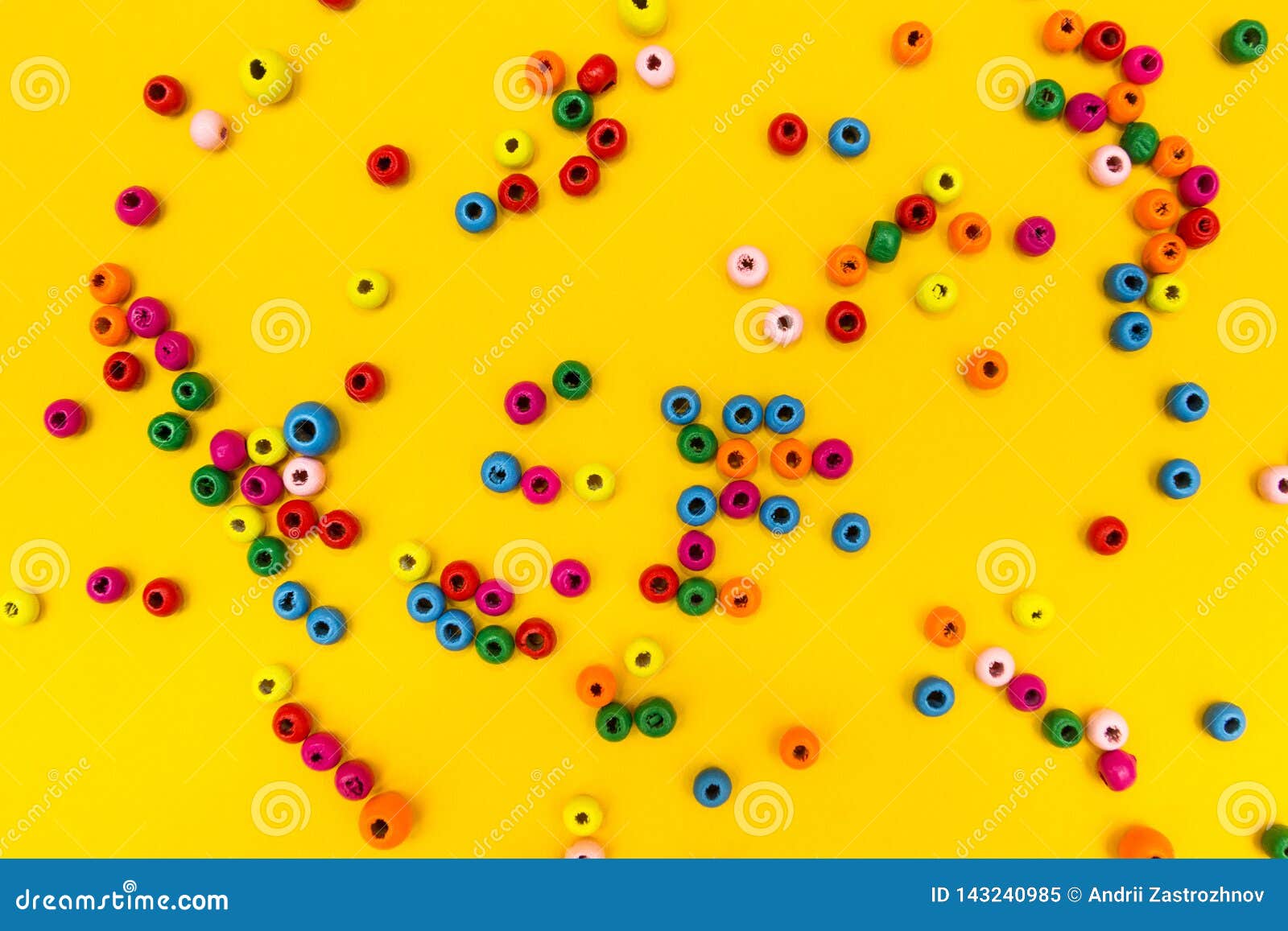 Spilled Multi-colored Beads on a Yellow Background Stock Image - Image ...