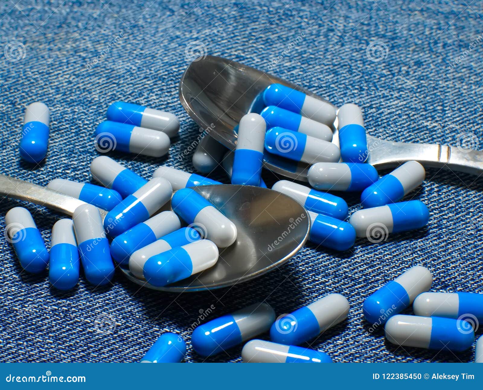Spilled pills on the table stock photo. Image of table - 122385450