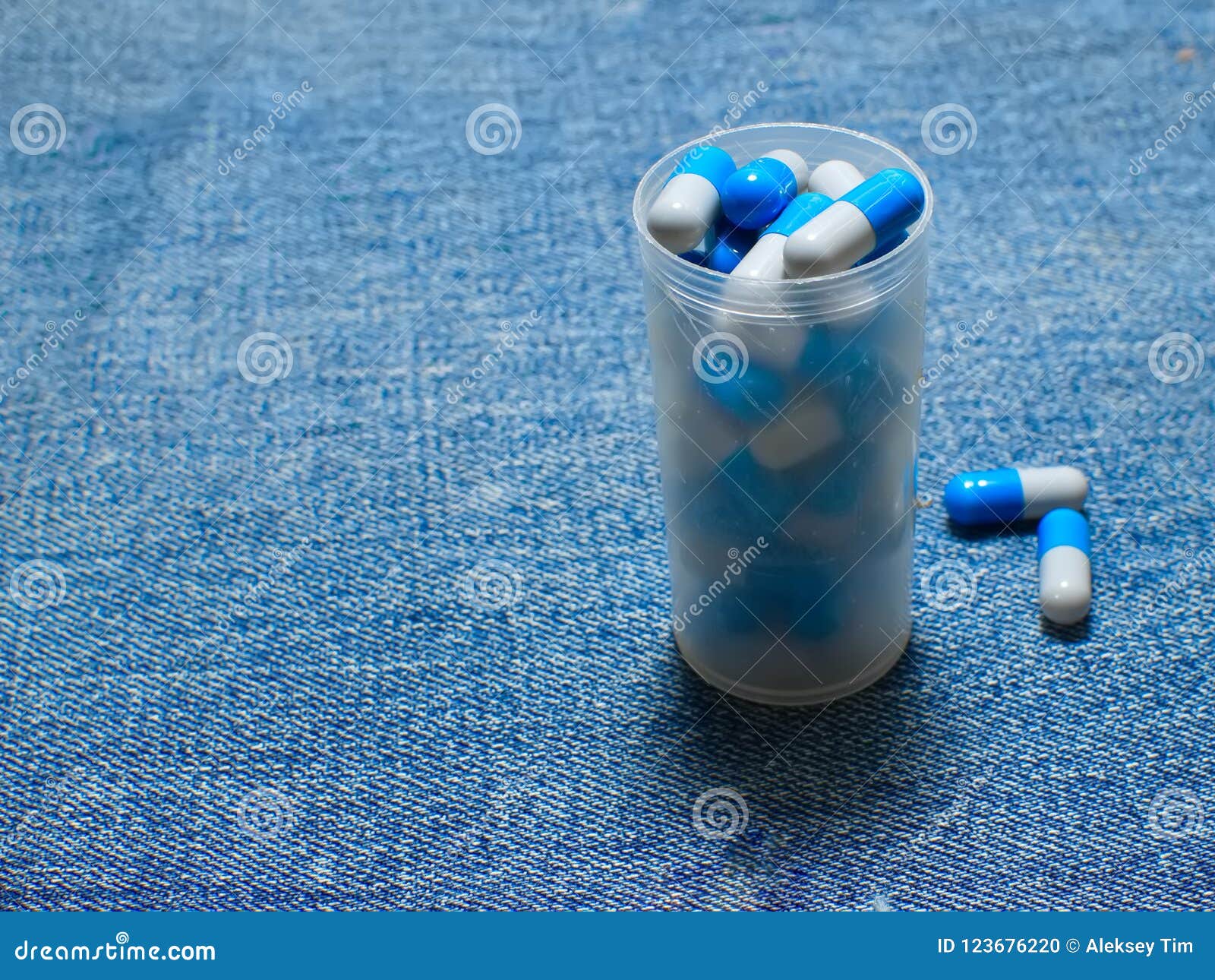 Spilled pills on the table stock photo. Image of addiction - 123676220