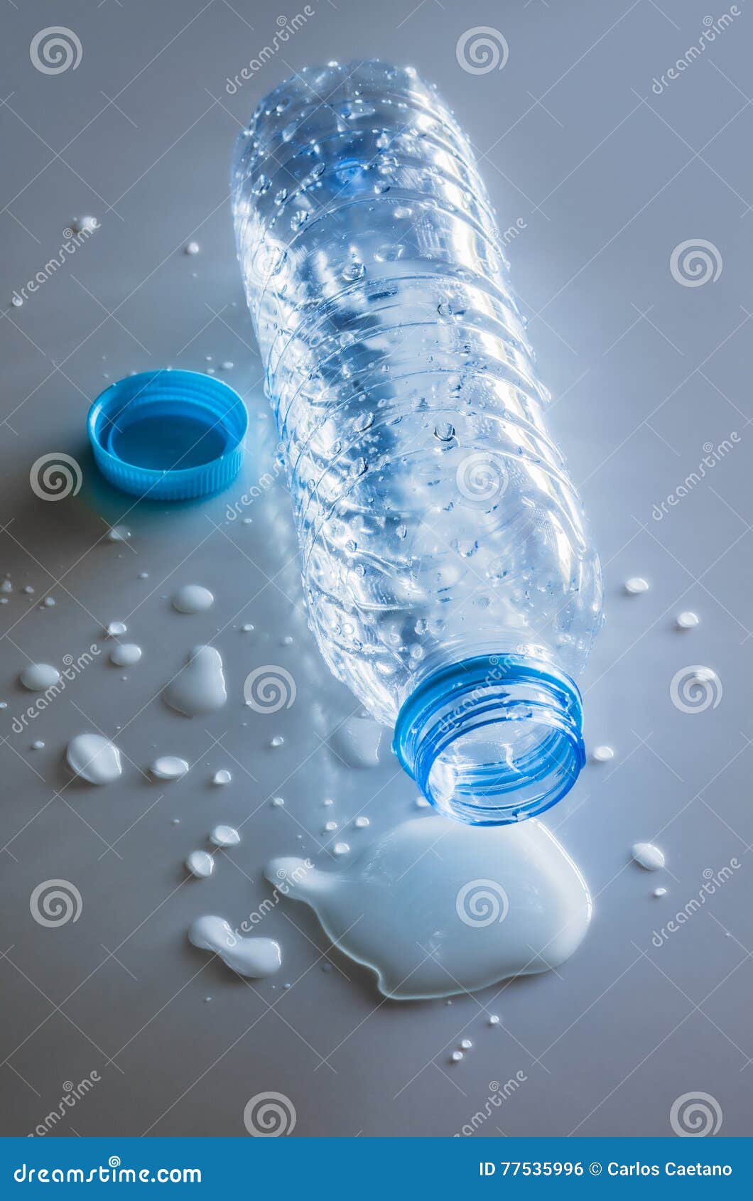 Spilling Water Bottle stock photo. Image of bottled, freshness - 77535996