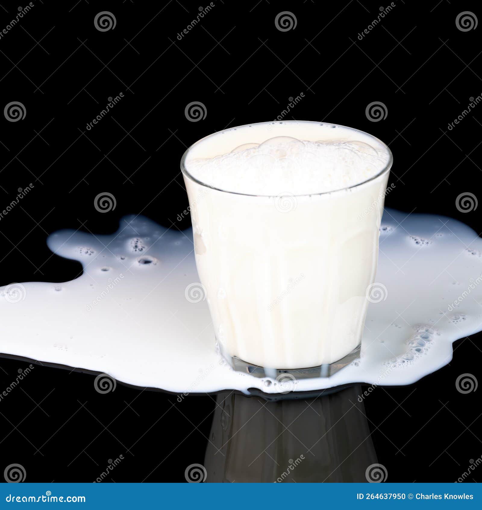 Spilt Milk on a Black Reflective Surface Stock Photo - Image of pouring ...