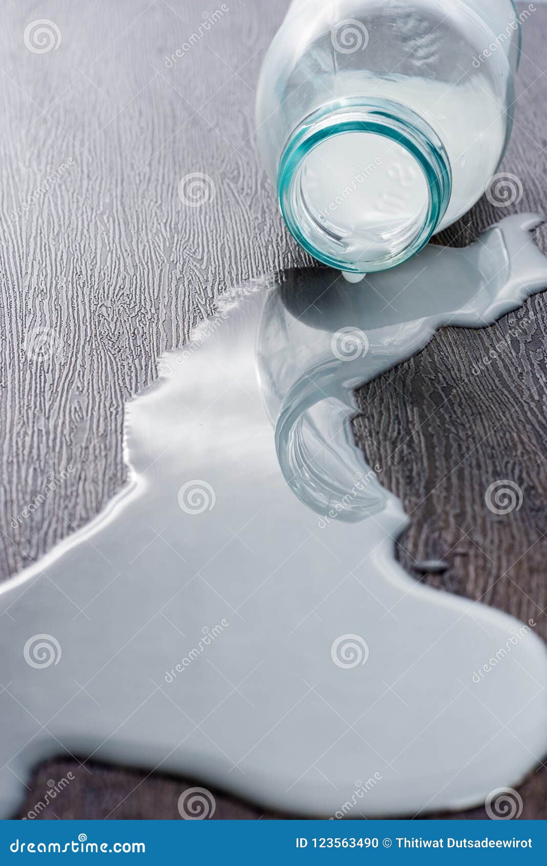 Spilt milk from bottle stock photo. Image of glass, nature - 123563490