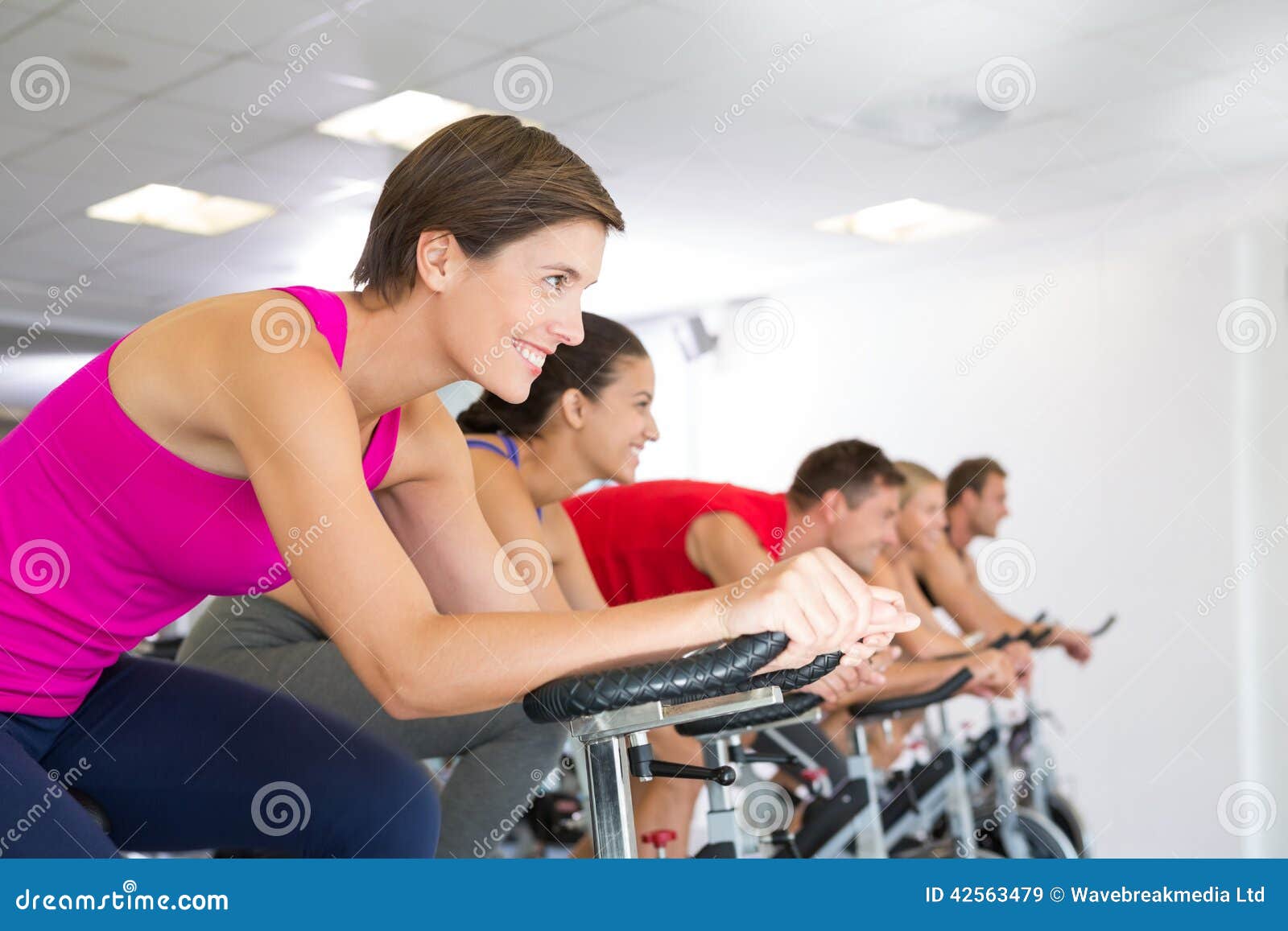 Spin Class Working Out and Smiling Stock Image - Image of young, people ...