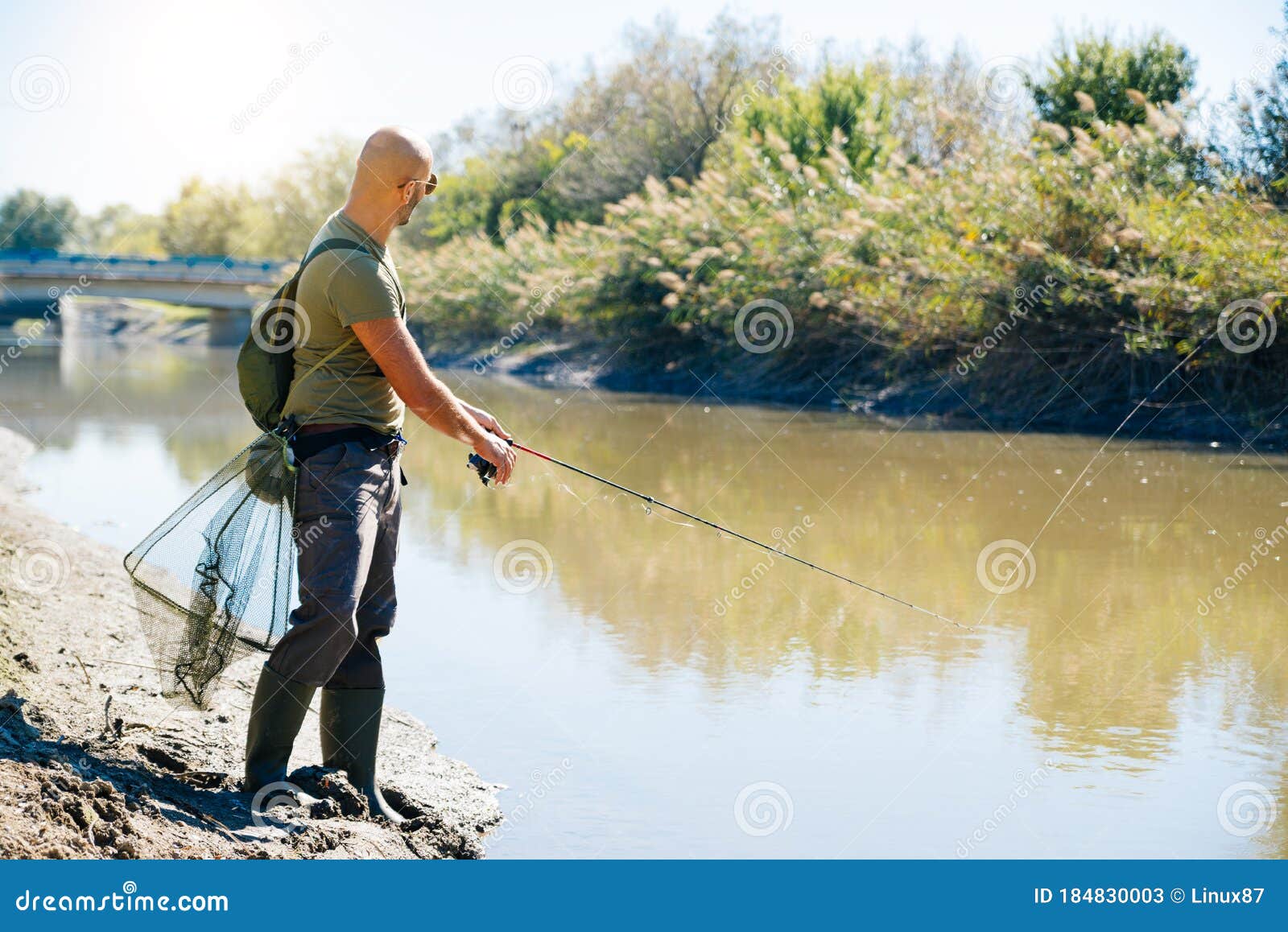 Spin fishing on a river stock image. Image of freshwater - 184830003