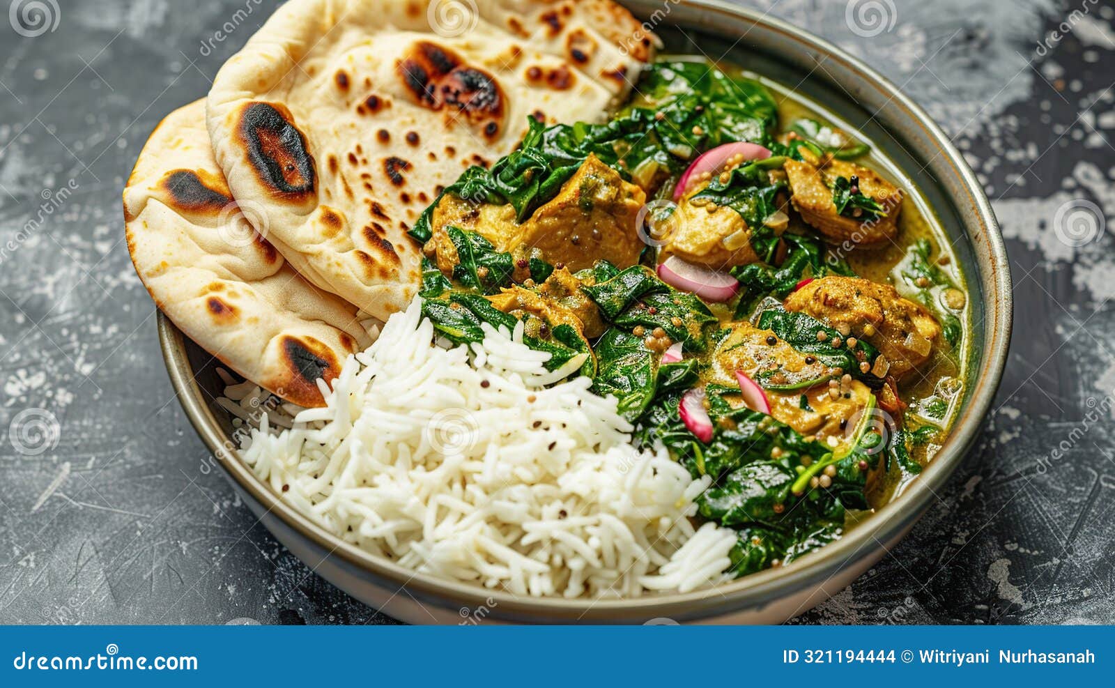 Spinach Chicken Or Murg Saagwala Served In A Bowl With Naan And Rice ...