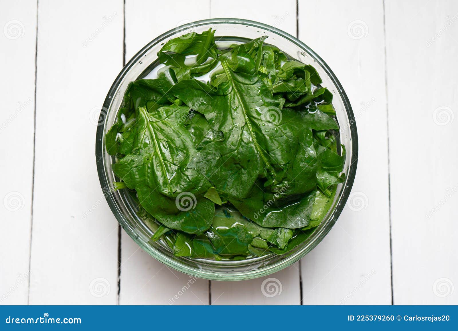 Spinach Leaves Washed in Bowl on White Background Stock Photo - Image ...