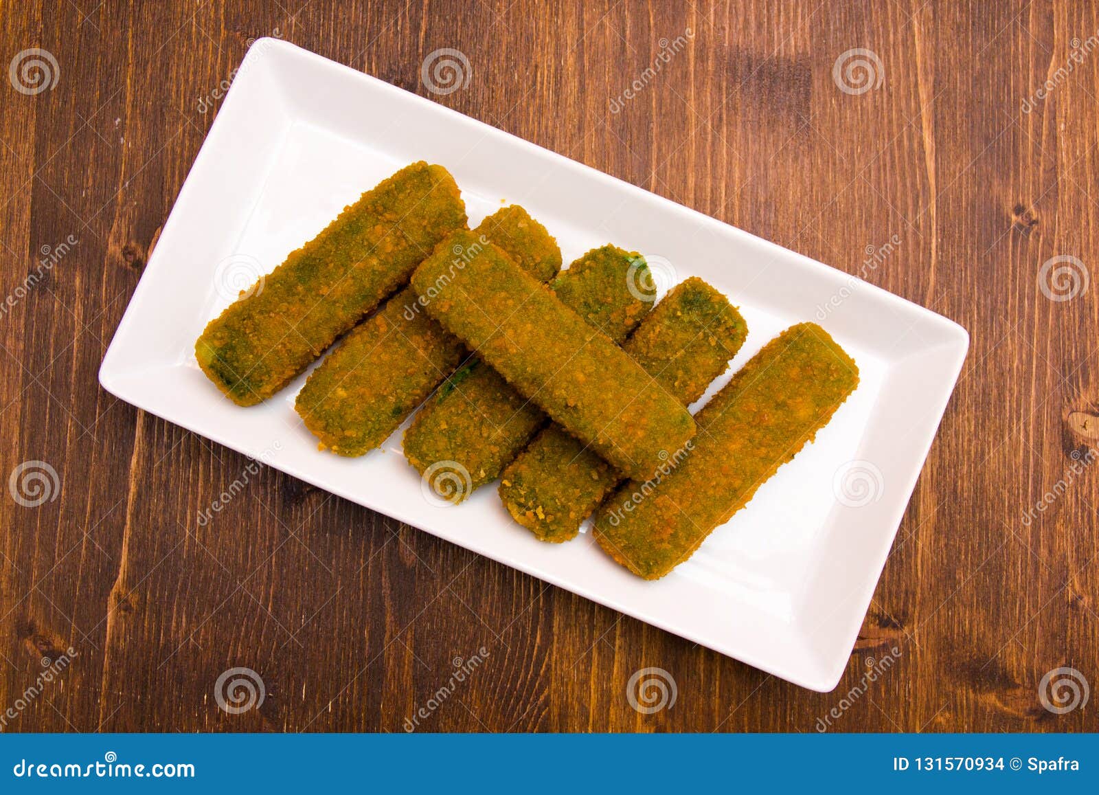 Spinach Sticks on a Tray on Wood from Above Stock Photo - Image of ...