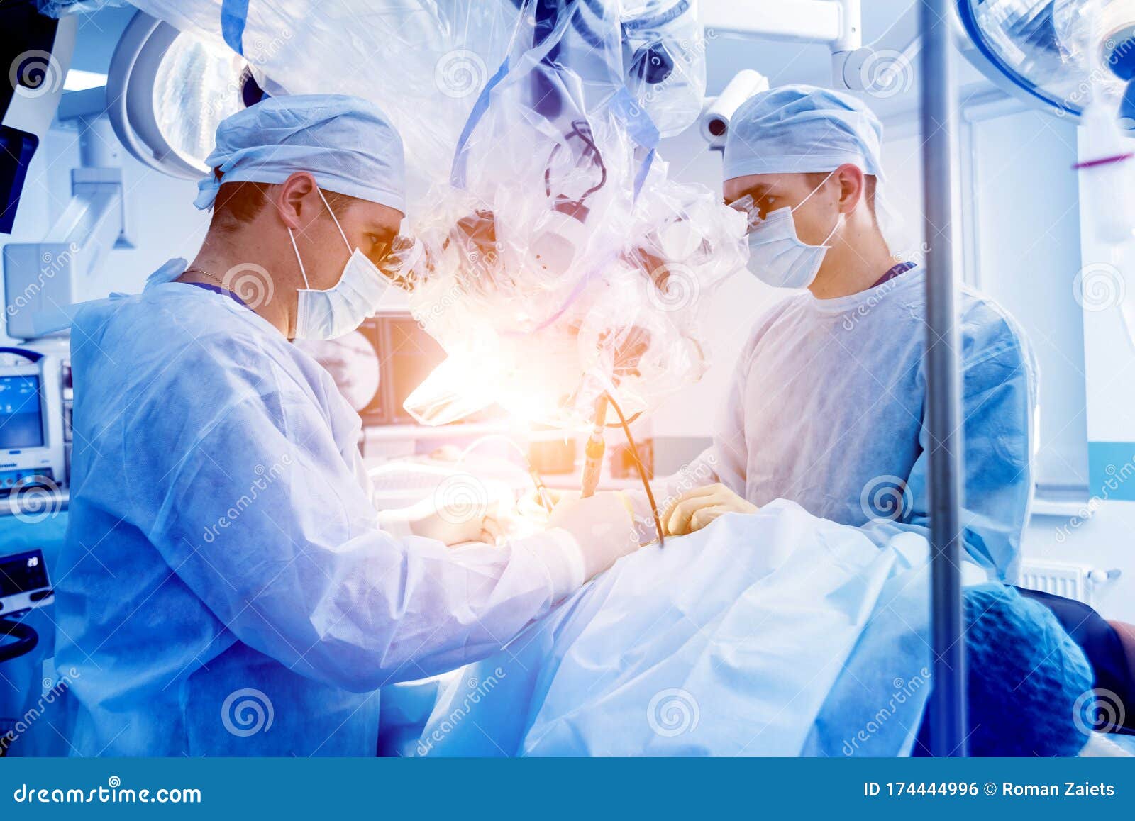 Spinal Surgery. Group of Surgeons in Operating Room with Surgery ... Spinal Surgery. Group of Surgeons in Operating Room with Surgery ...
