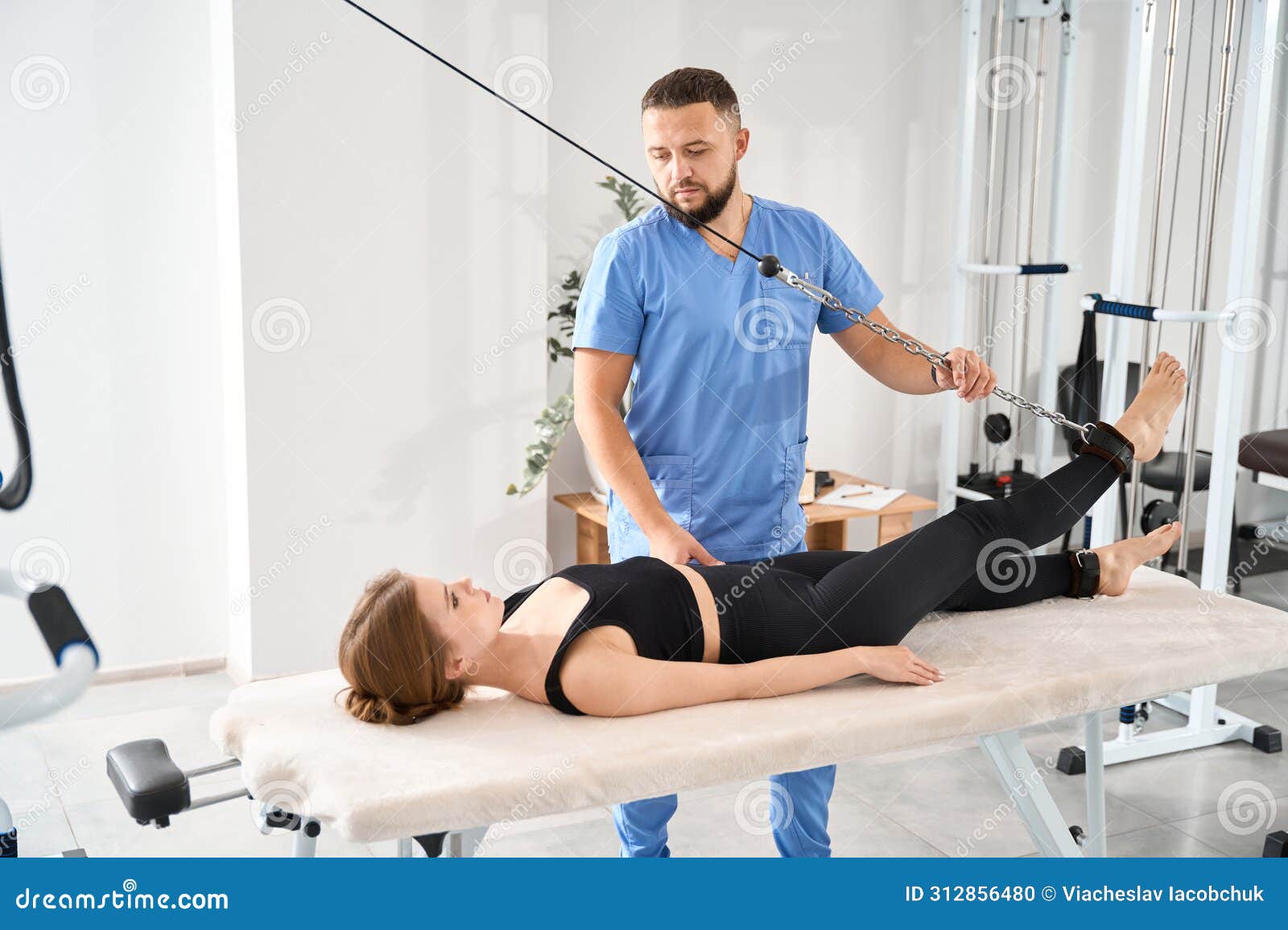Spinal Traction Procedure on a Special Simulator Stock Photo - Image of ...