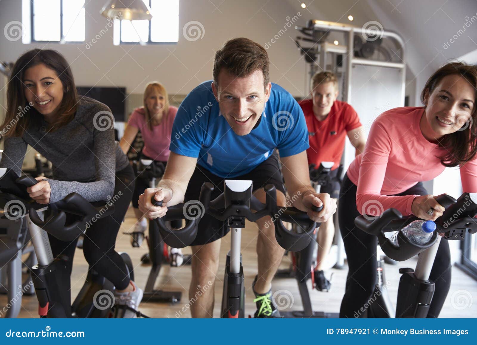 Spinning Class on Exercise Bikes at a Gym Looking To Camera Stock Image ...