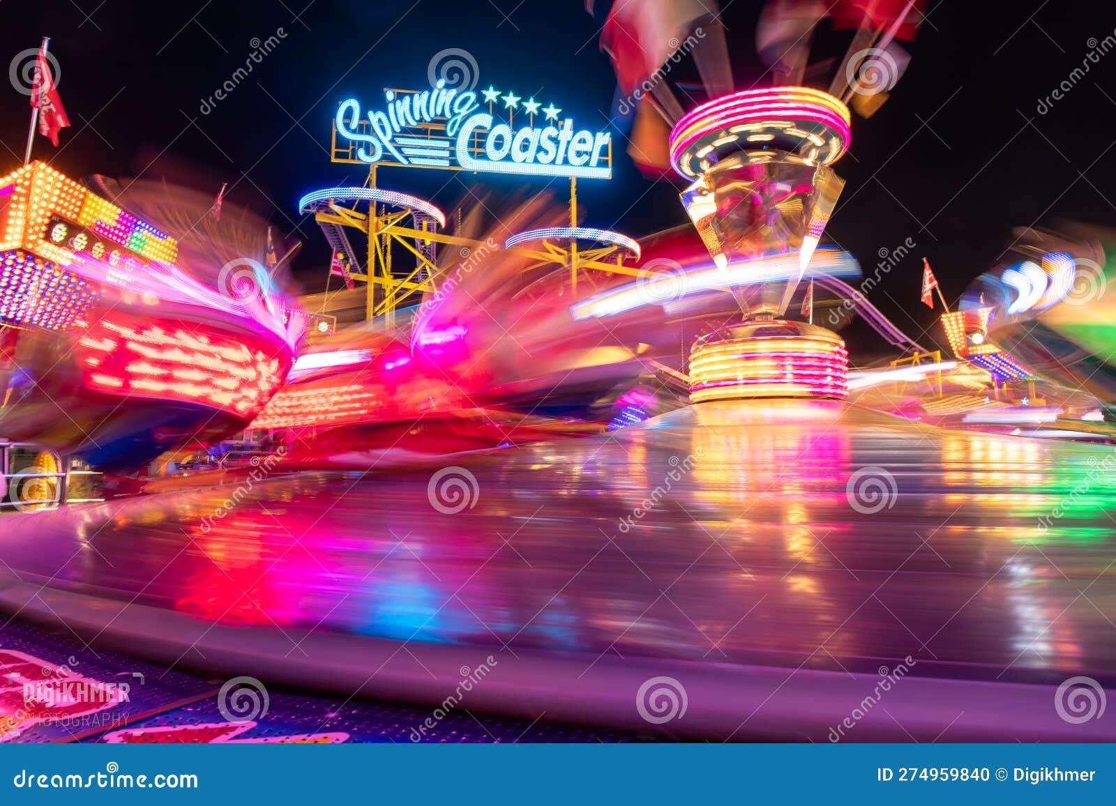 Vivid Multicolor Spinning Coaster at Night Stock Photo - Image of ...