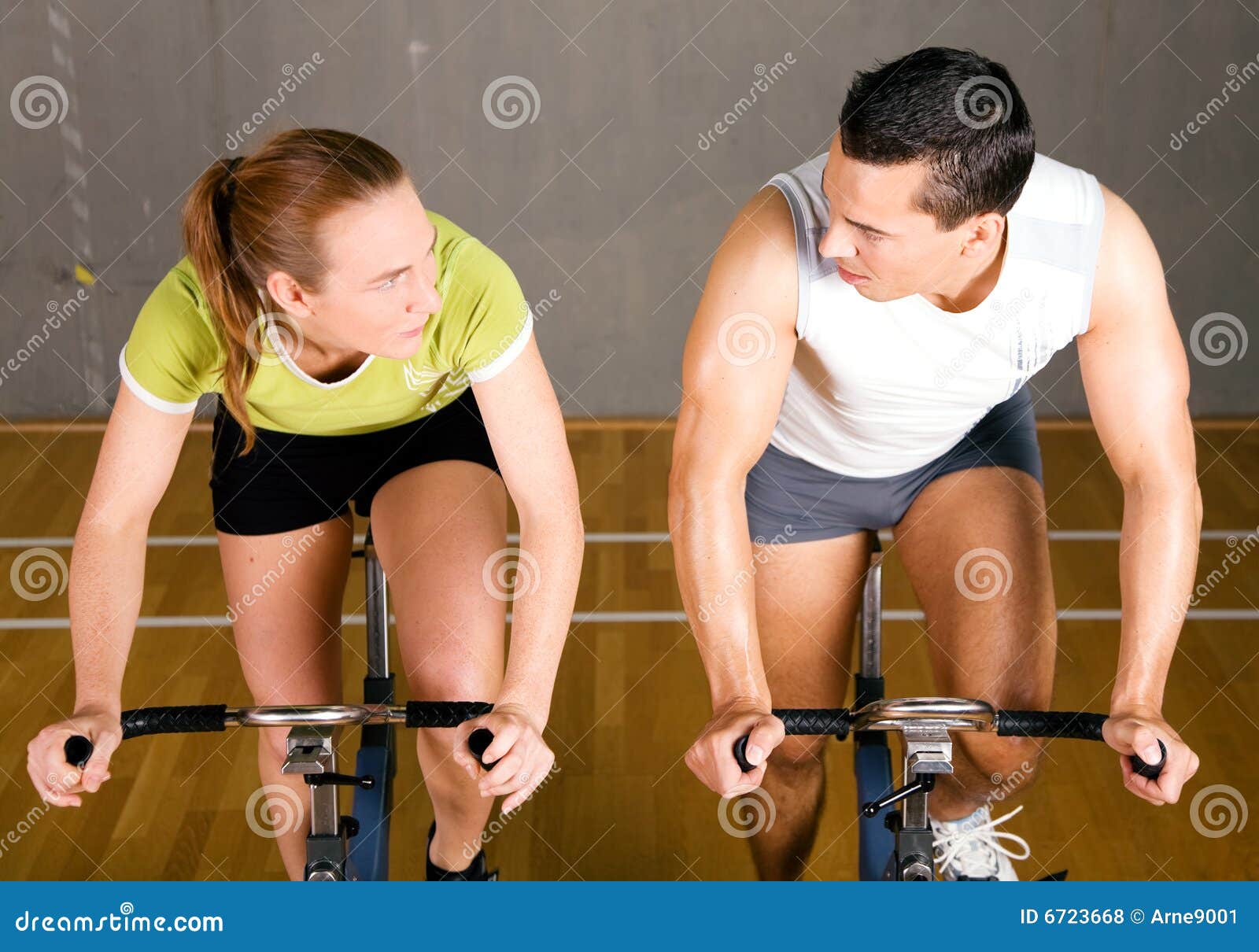 Spinning couple in gym stock photo. Image of woman, shape - 6723668