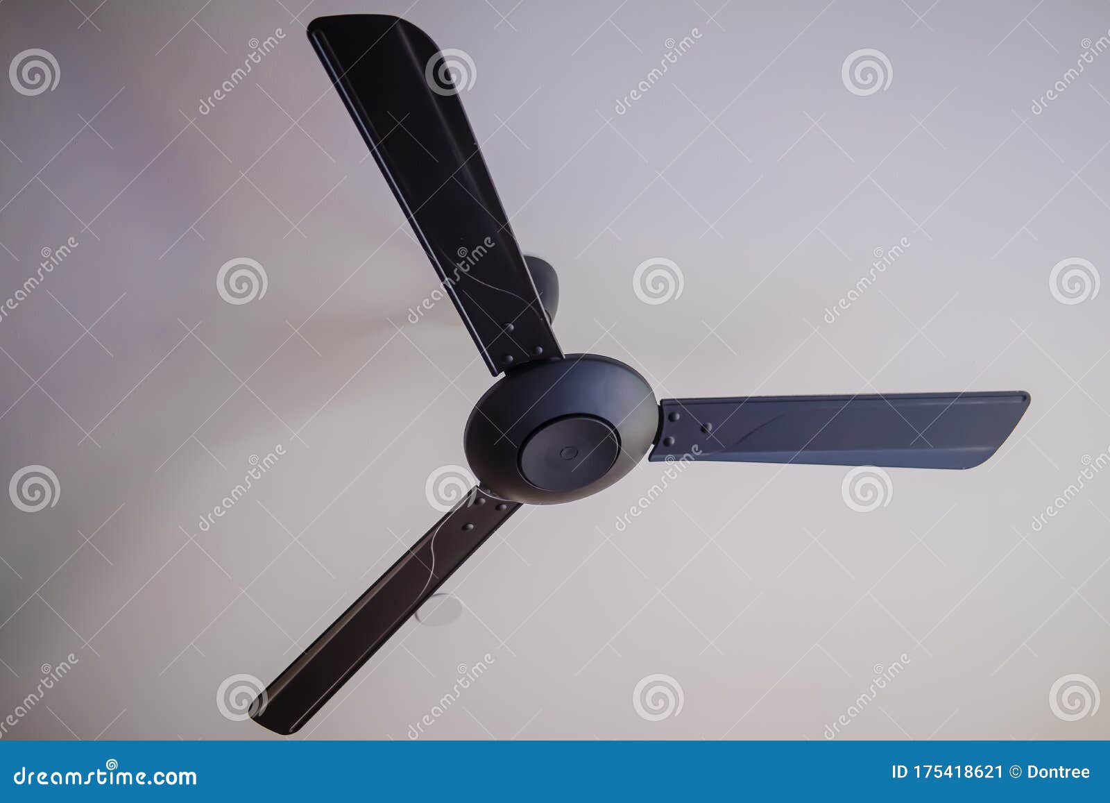 A Spinning Fan on the Black Ceiling Stock Image - Image of bulb ...