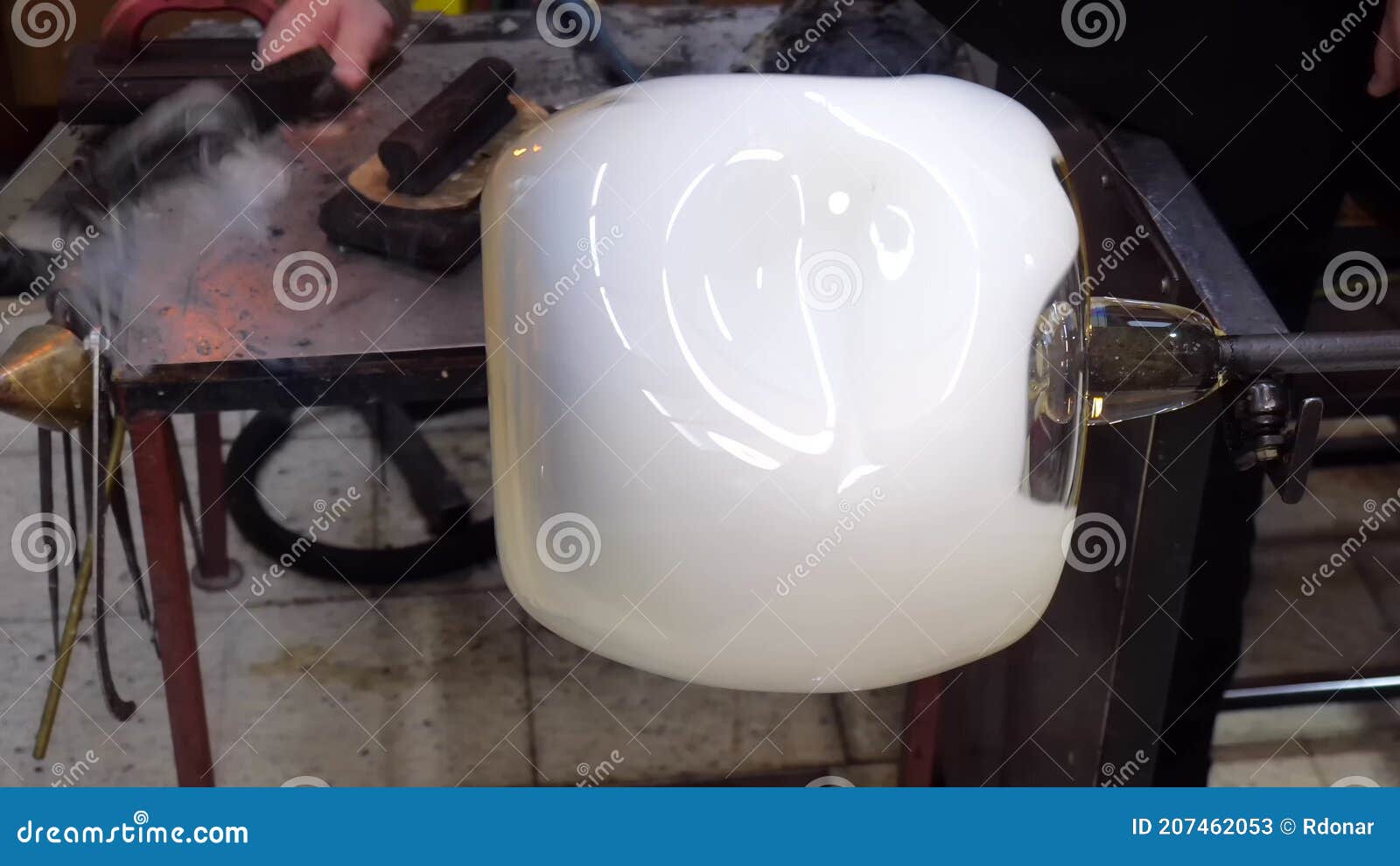 Spinning Glass on a Glass Tube. Two Artists Adjust the Base To Create a ...