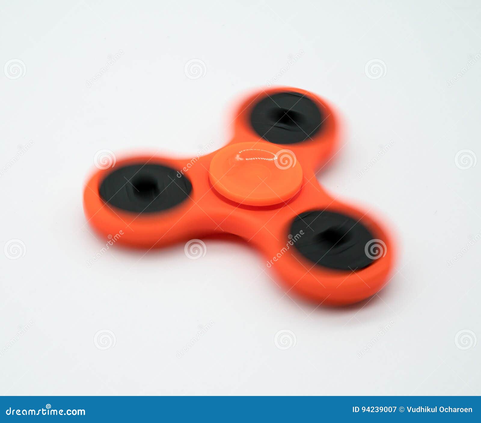 Spinning Orange Fidget Spinner Stock Image - Image of finger, black ...