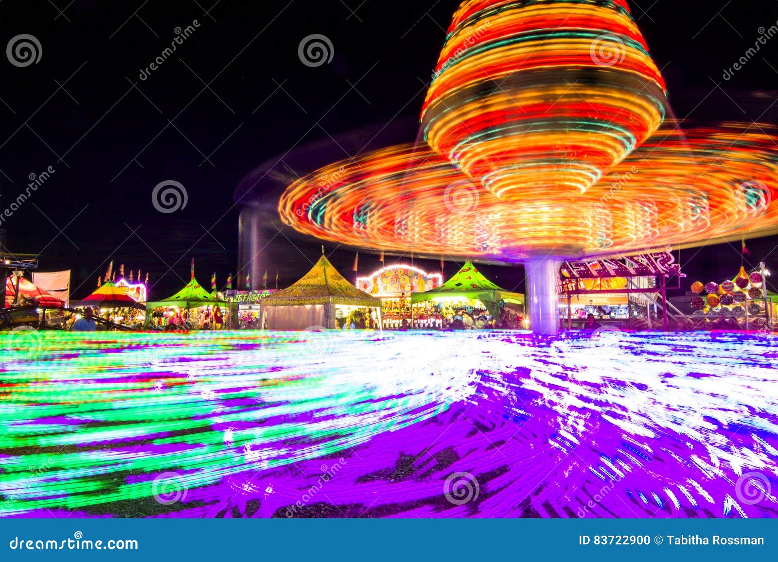 Spinning Ride of Colors at the Fair Stock Photo - Image of spinning ...