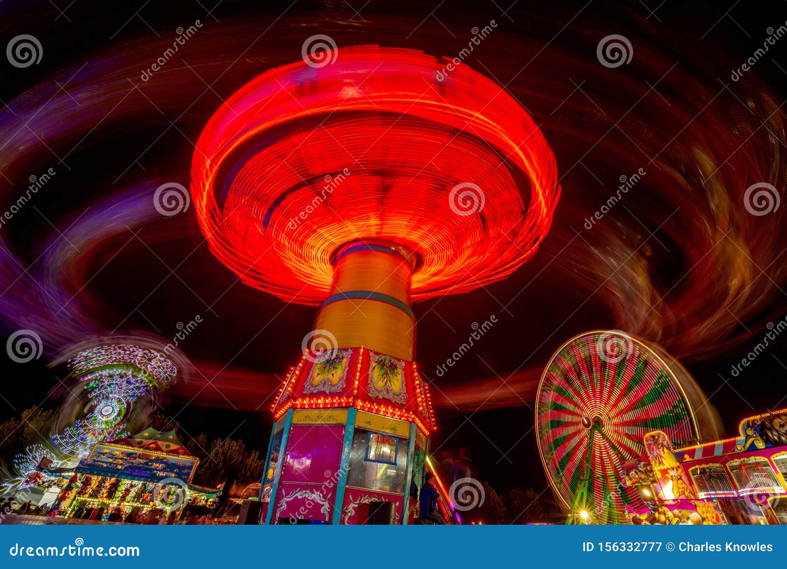 Spinning Ride at the Fair in the Late Night Illuminated with Lights ...