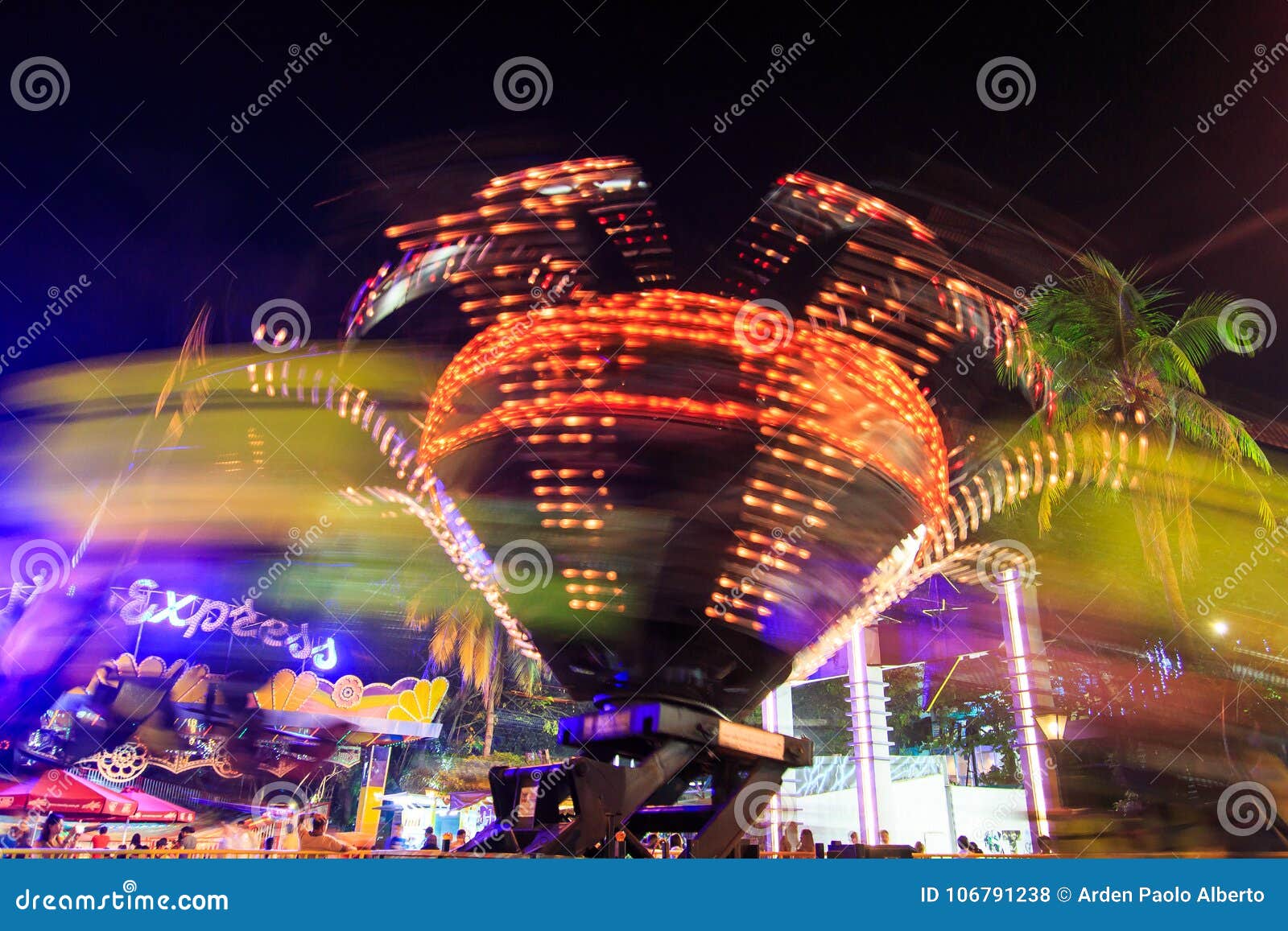 Spinning Ride at the Theme Park. Stock Photo - Image of motion, lights ...