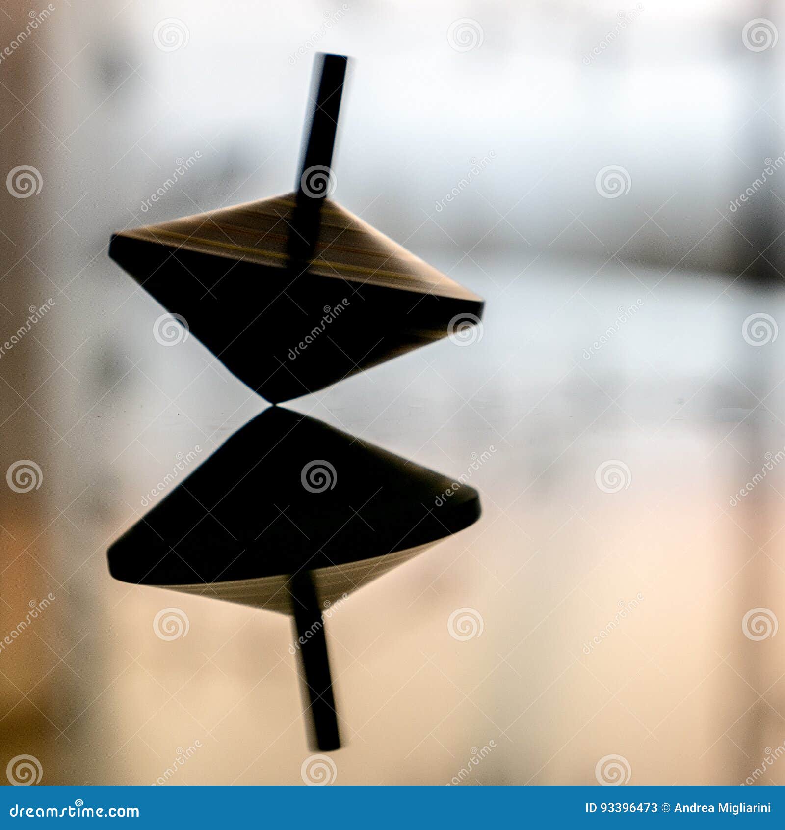 Spinning Top in Action on a Mirror Surface Stock Image - Image of ...