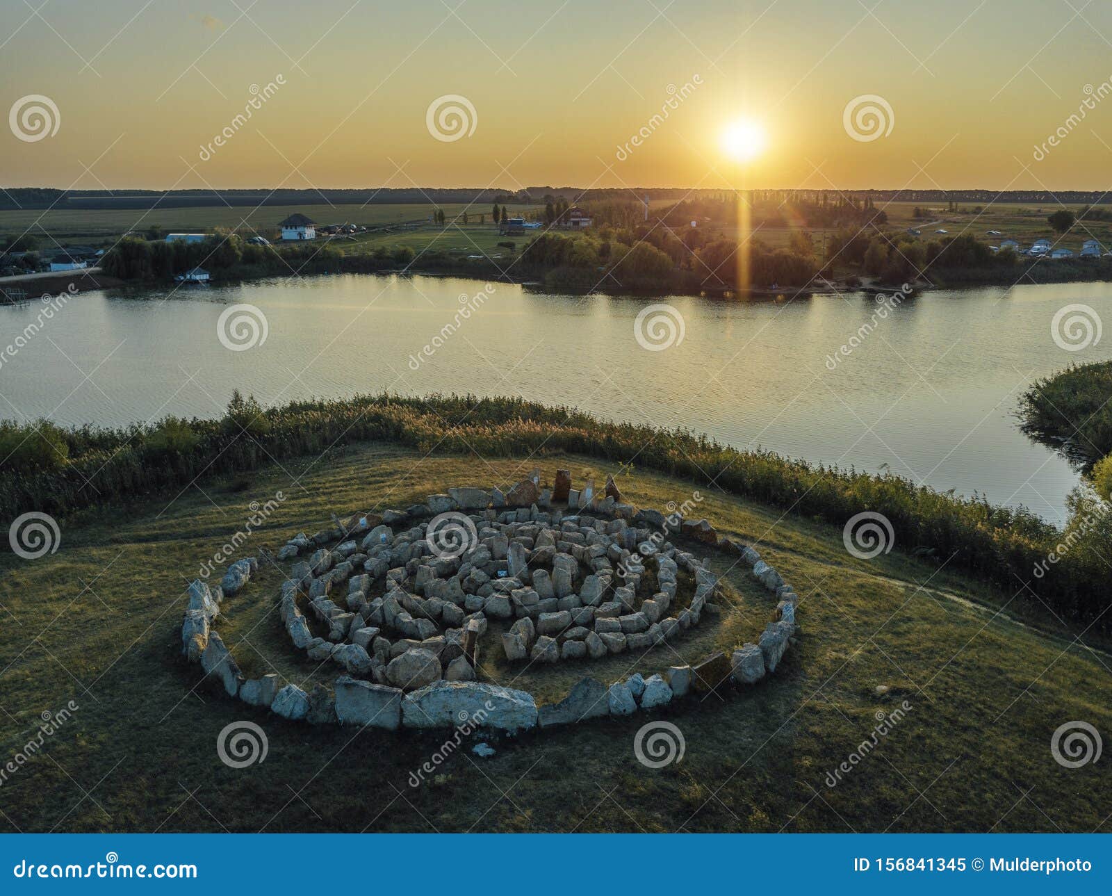 Spiral Labyrinth Made of Stones on Sunset Lake Stock Image - Image of ...