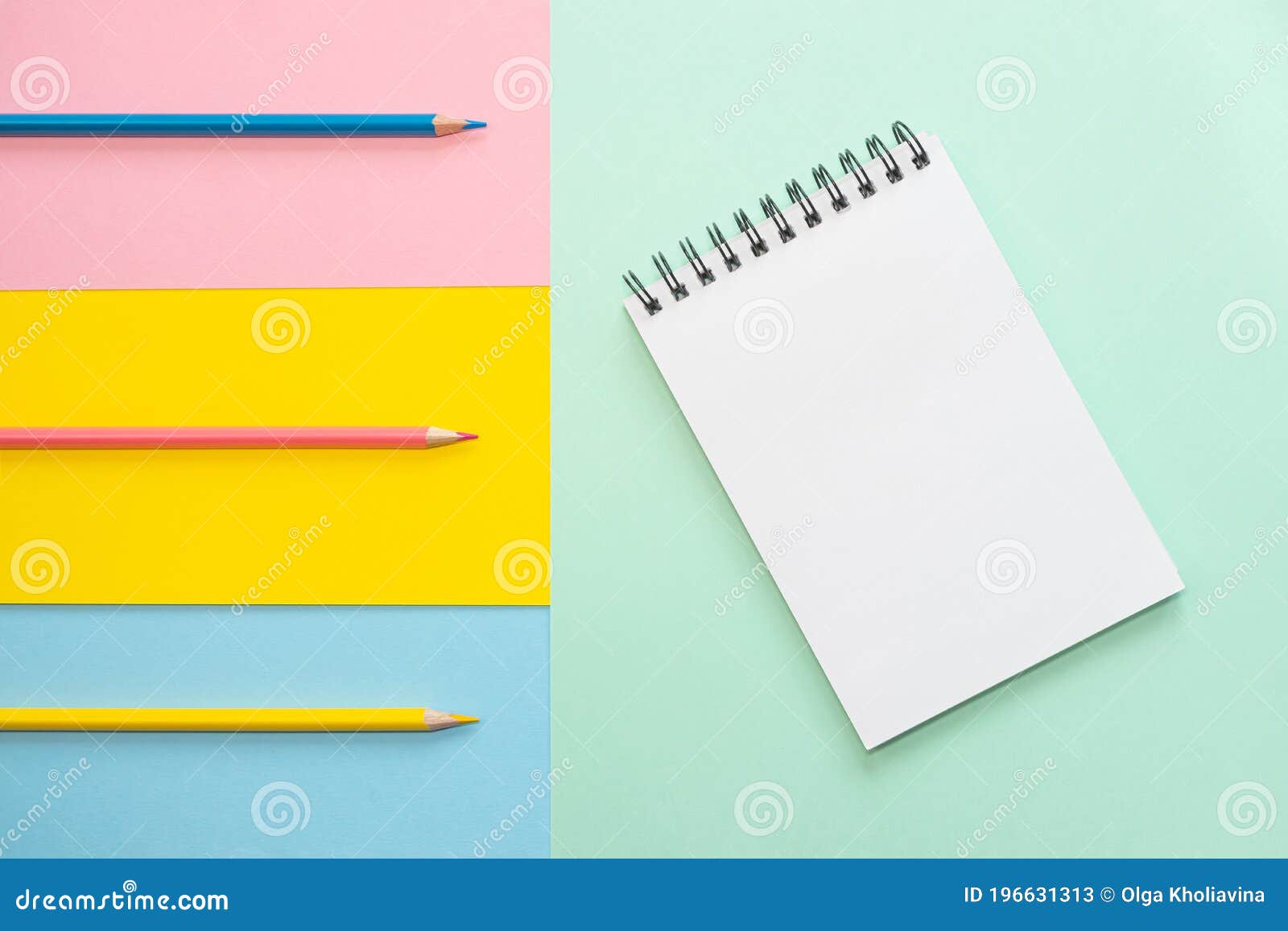 Spiral Notebook with Blank White Sheet and Colored Pencils on Multi ...