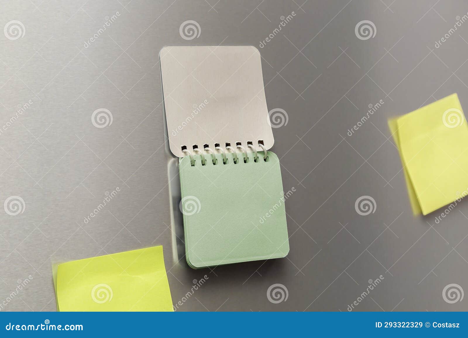 Spiral notebook on fridge stock image. Image of notebook - 293322329