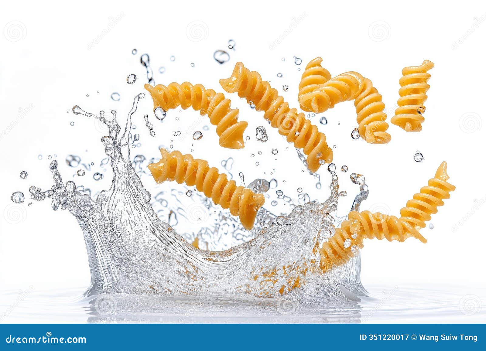 Spiral Pasta Being Splashed with Water Creating a Big Splash on White ...