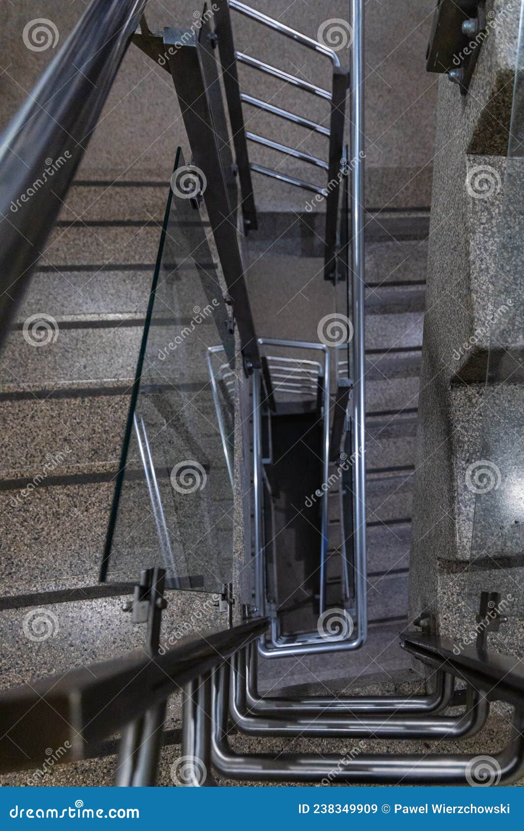 Spiral Rectangle Staircase with Metal Railings and Terrazzo on the ...