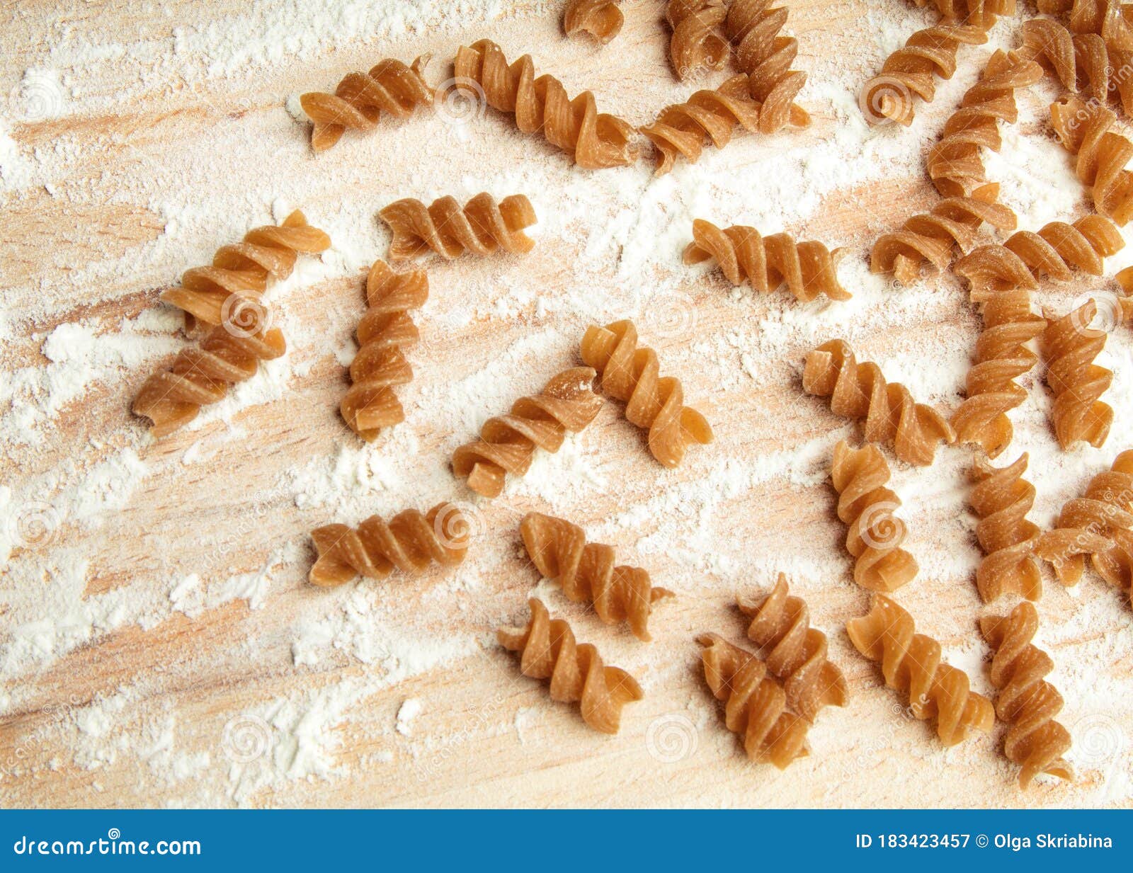 Spiral-shaped Pasta on a Board Stock Image - Image of sprinkled, food ...