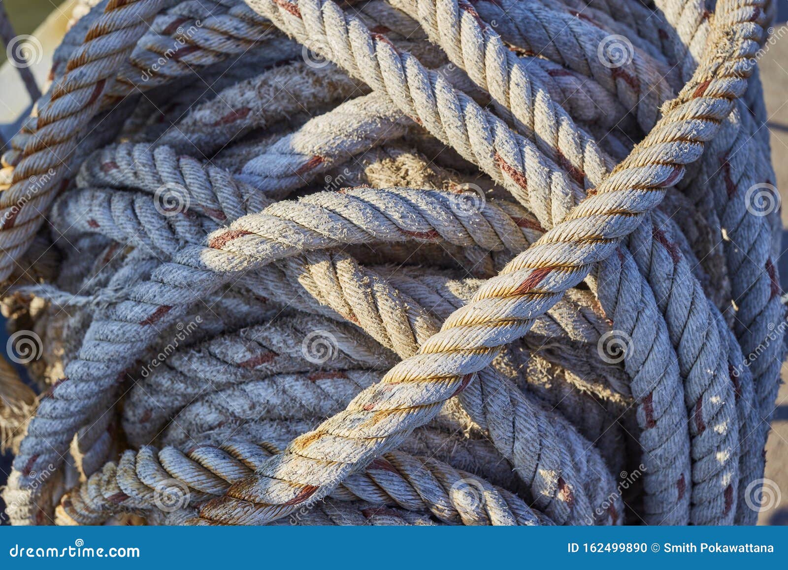 Spiral Ship Rope Lying Down On Dark Brown Deck As Background Texture ...