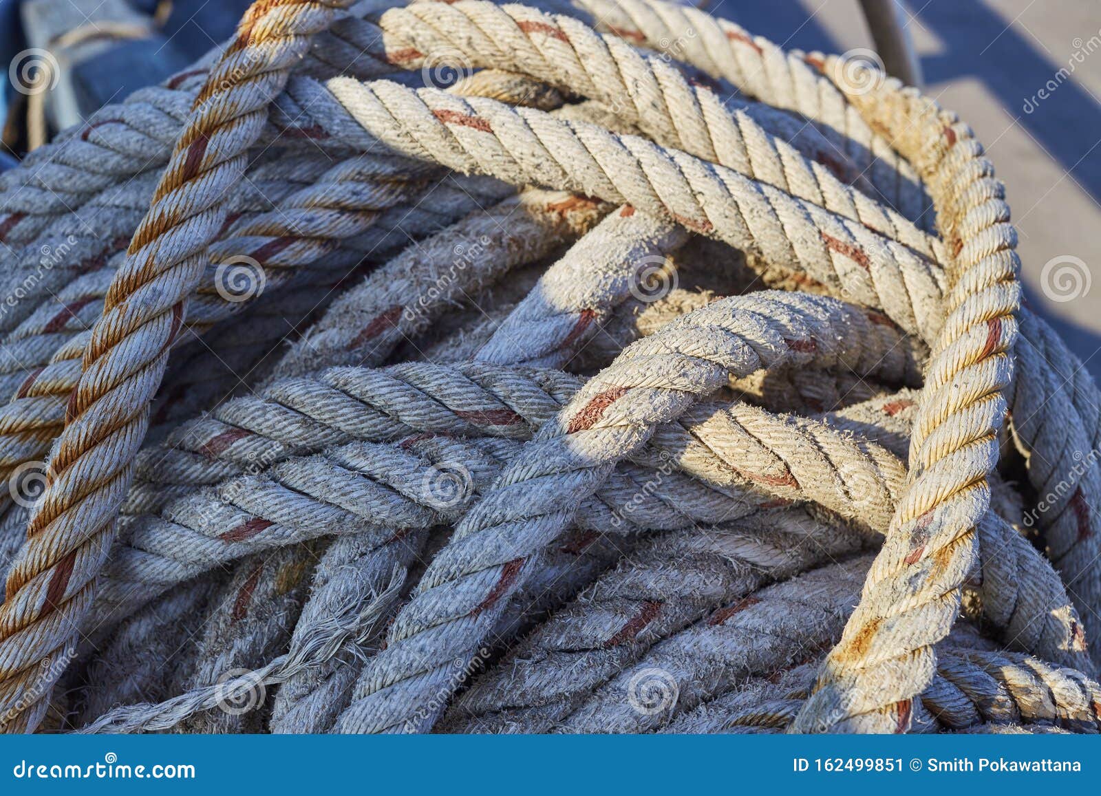 Spiral Ship Rope Lying Down On Dark Brown Deck As Background Texture ...