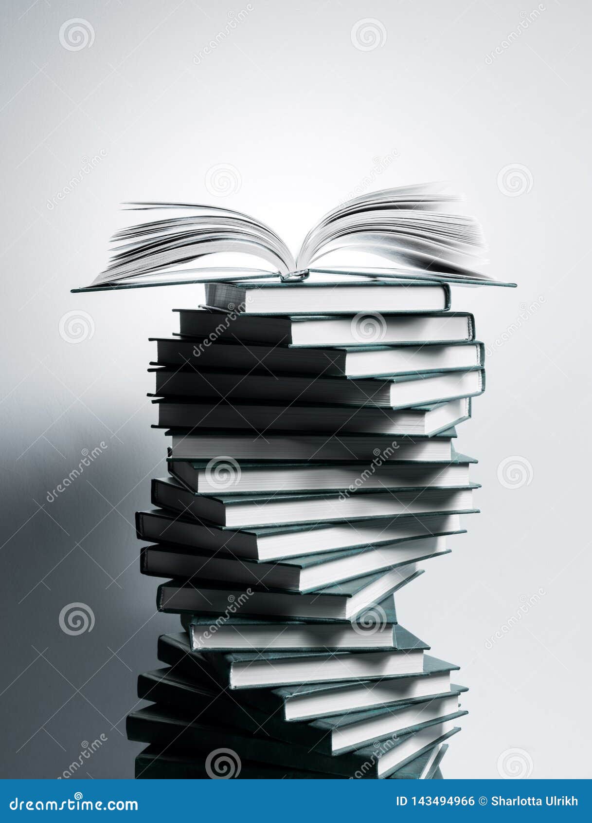 A Spiral of Stacks of Books in the Form of DNA and an Open Textbook at ...