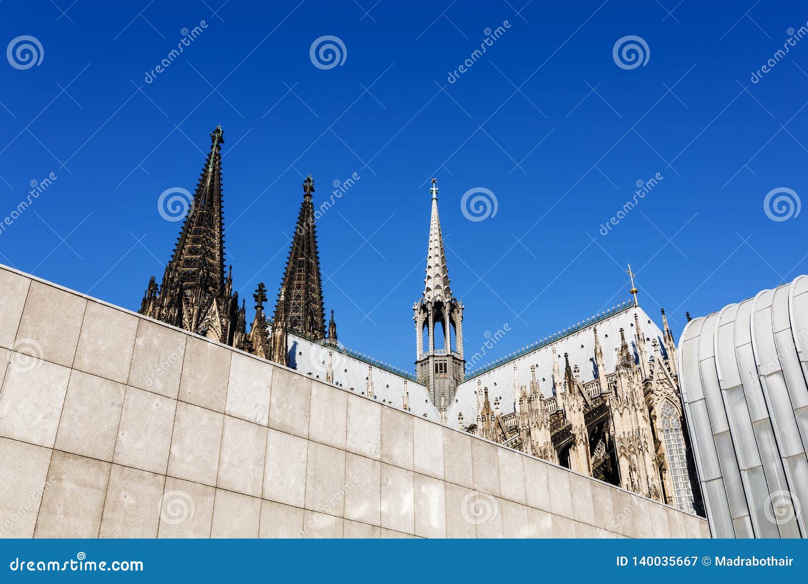 Spires of the Cologne Cathedral Behind a Museum in Cologne, Germany ...
