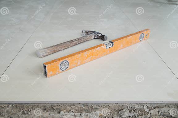Spirit Level and Hammer (tool for Working Tile) Stock Photo - Image of ...