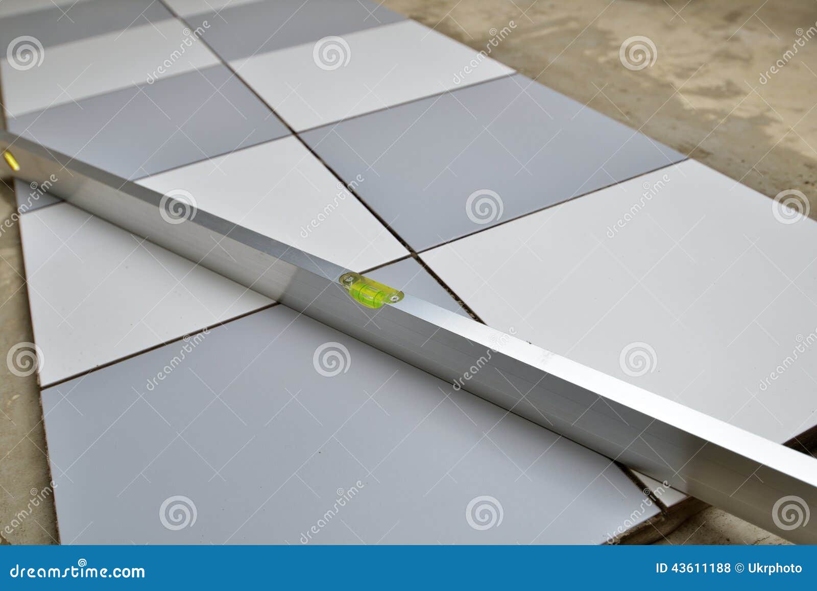 Spirit level on the tiles stock photo. Image of white - 43611188