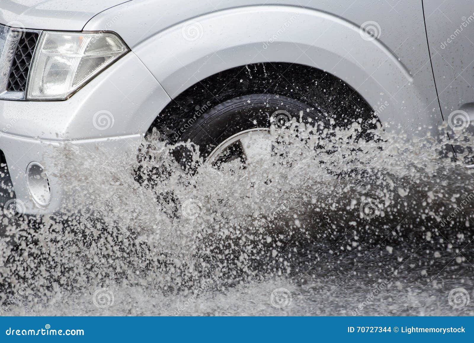 Mud Splash By A Car As It Goes Through Flood Water Stock Photo ...