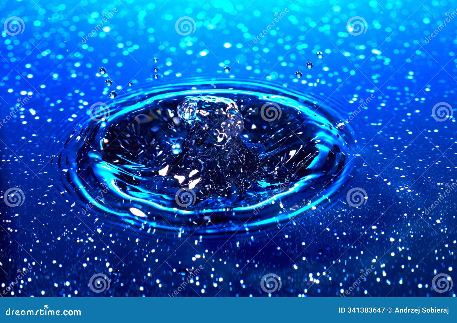 Splash - a Drop Falling Onto the Water Surface in Macro Shot Stock ...
